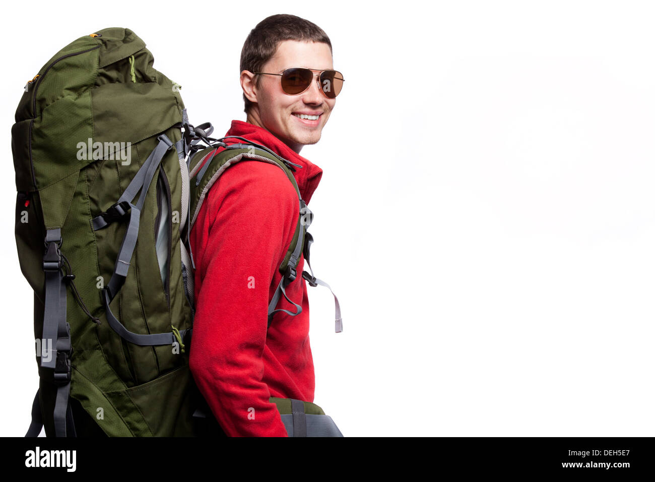 Hiker with backpack standing at white background Stock Photo - Alamy
