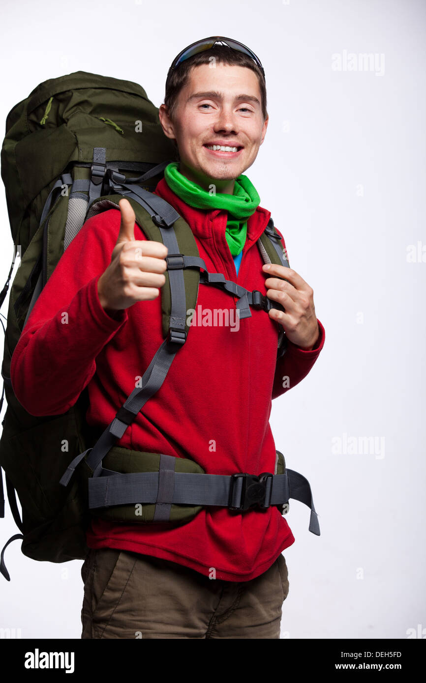Full length portrait of a hiker with backpack posing isolated on white ...