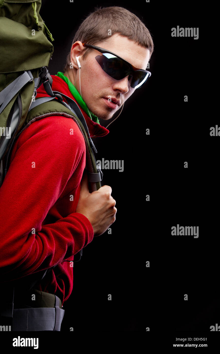 young man with backpack walking Stock Photo - Alamy