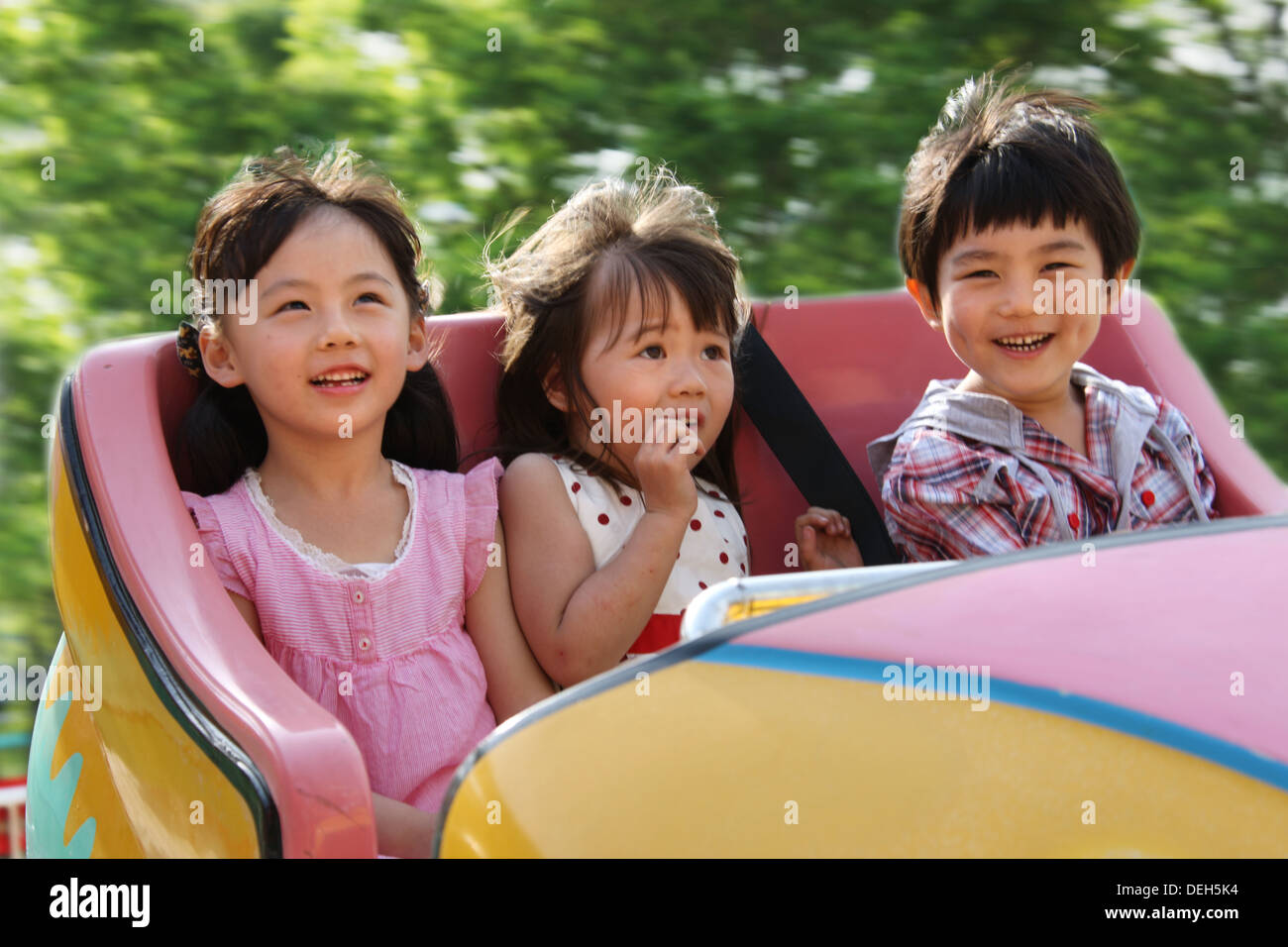 Oriental children playing outdoors Stock Photo - Alamy