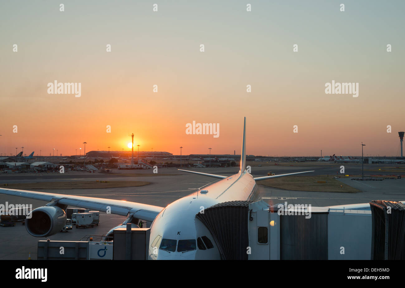 Heathrow Airport with sunsetting across the runways, London, England ...