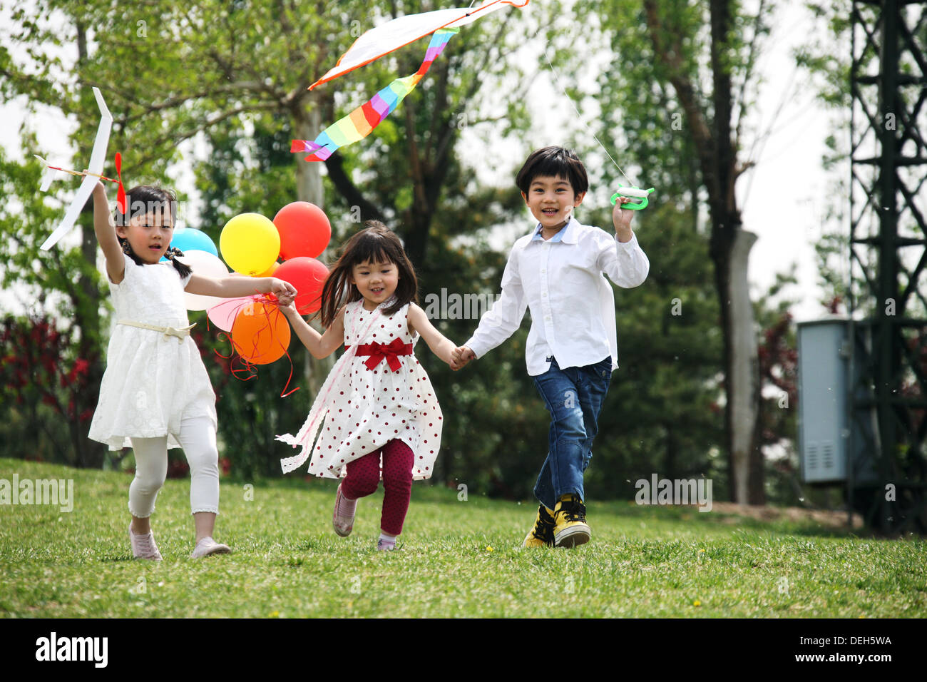 Oriental children playing outdoors Stock Photo - Alamy