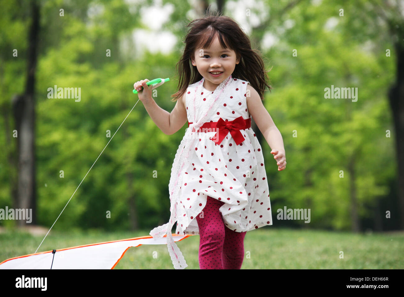 A girl playing outside Stock Photo - Alamy