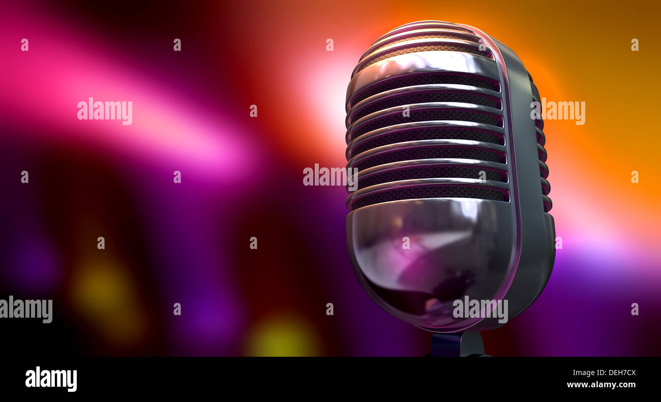 A chrome vintage microphone on a blurry purple, orange and pink ...