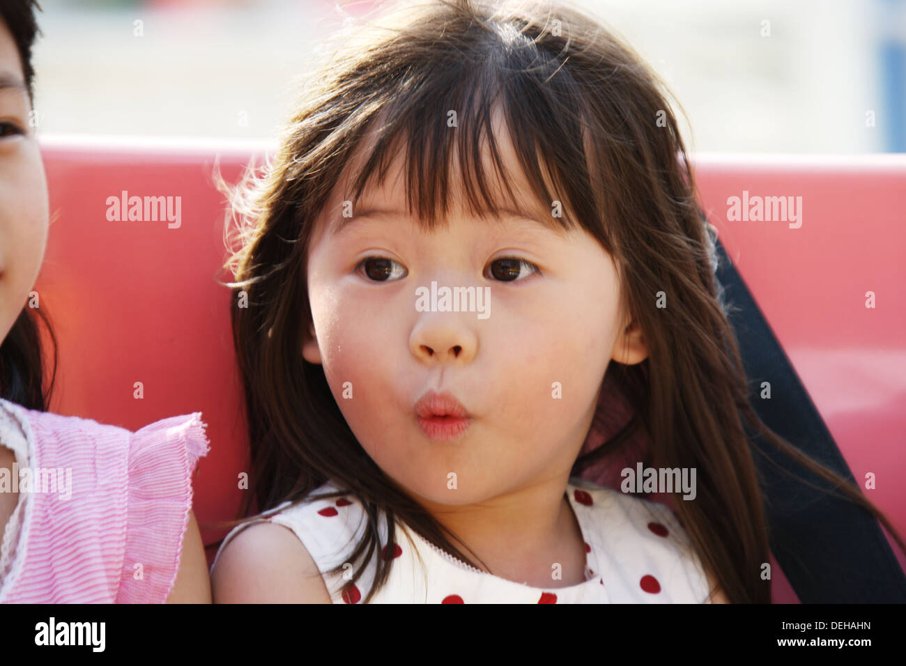 Oriental children playing outdoors Stock Photo - Alamy