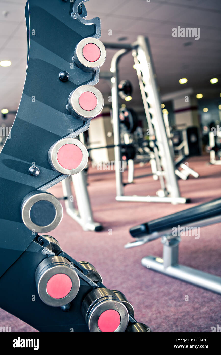 diverse equipment and machines at the gym room Stock Photo - Alamy
