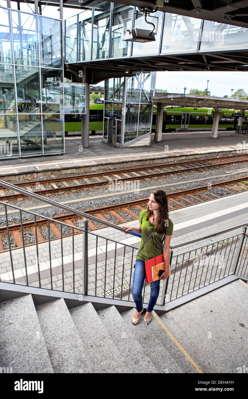 the outdoor portrait of a teenage girl at rail station Stock Photo - Alamy