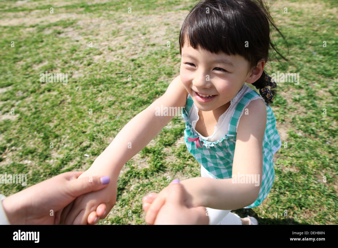 Oriental children playing outdoors Stock Photo - Alamy