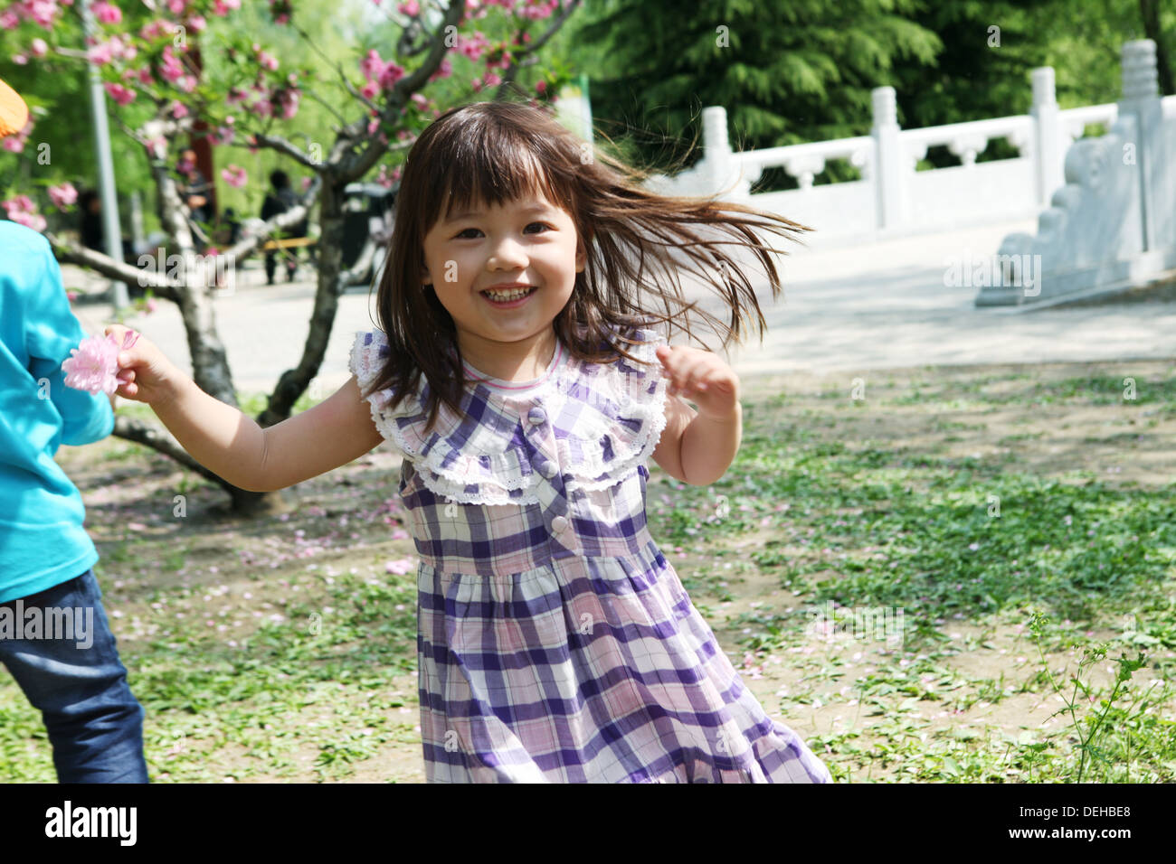 Oriental children playing outdoors Stock Photo - Alamy