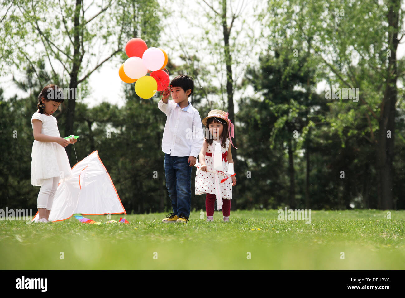 Oriental children playing outdoors Stock Photo - Alamy