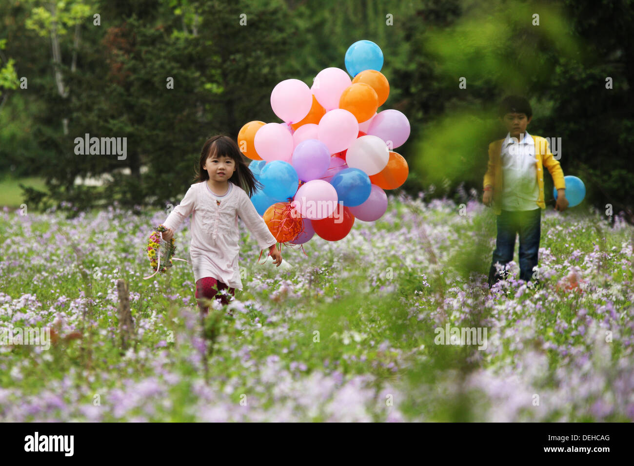 Oriental children playing outdoors Stock Photo - Alamy
