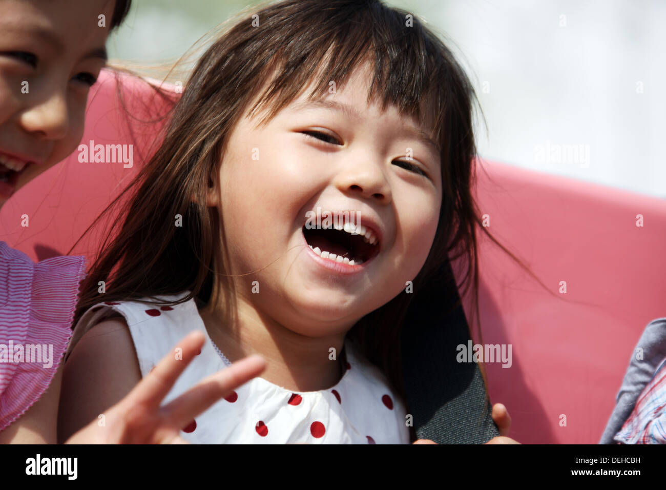 Oriental children playing outdoors Stock Photo - Alamy