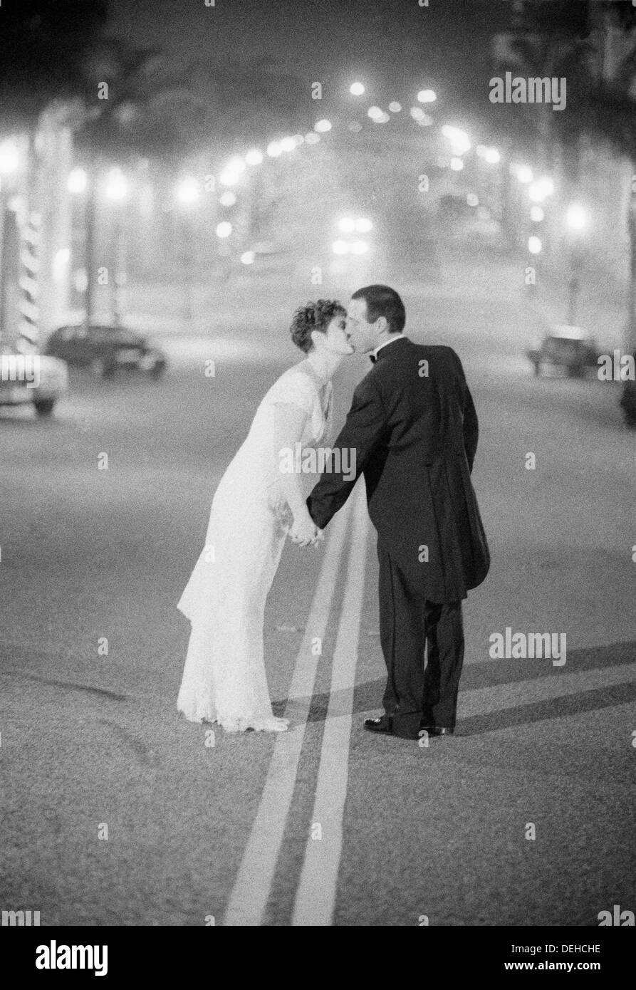 Newly married couple holding hands Black and White Stock Photos ...
