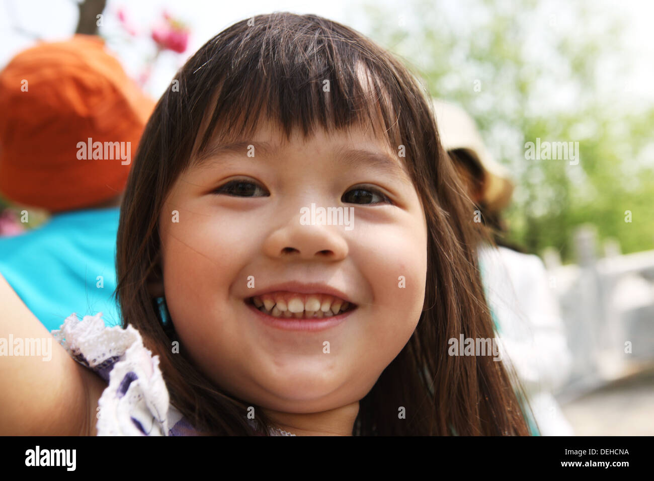Oriental children playing outdoors Stock Photo - Alamy