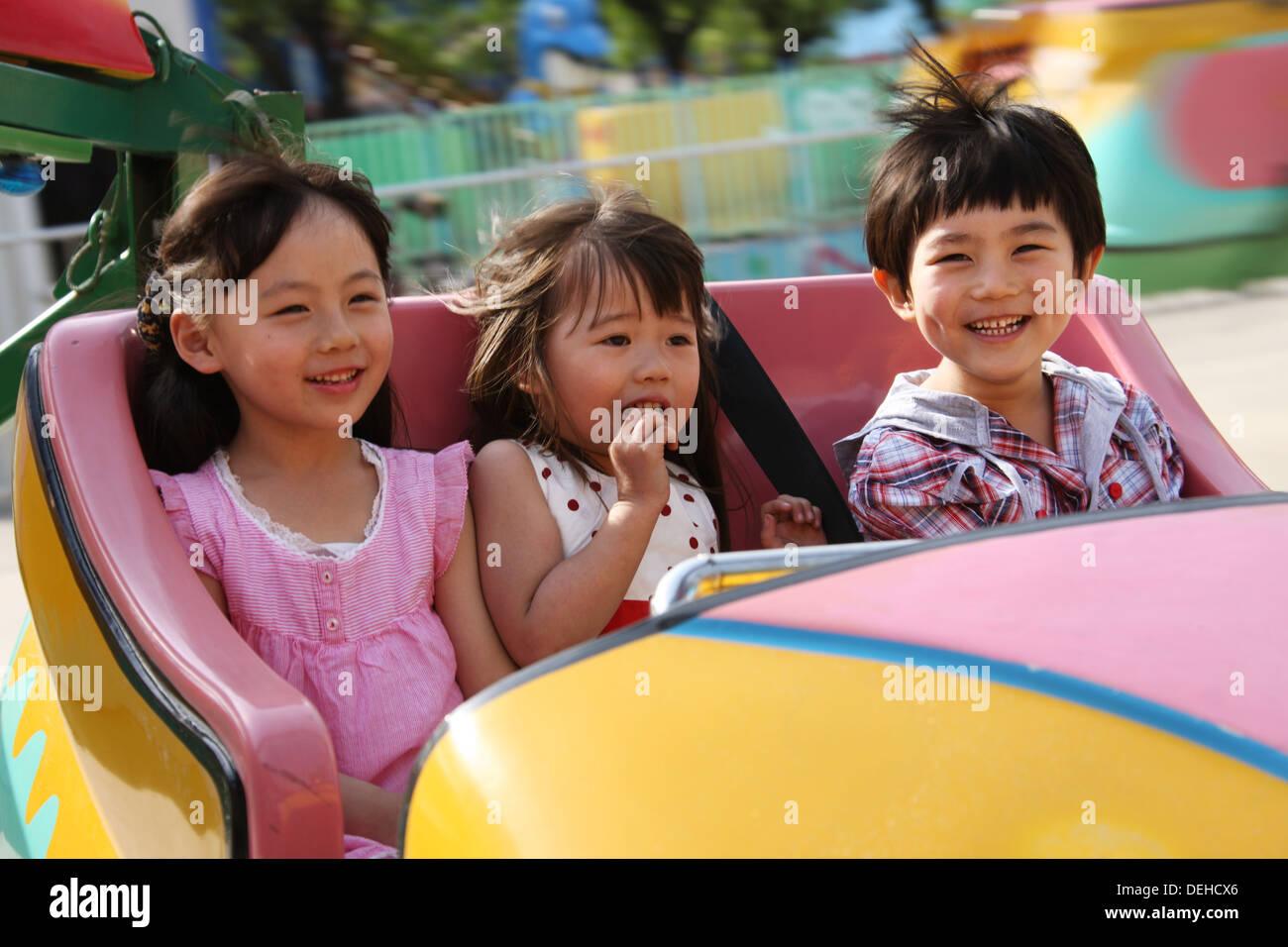 Oriental children playing outdoors Stock Photo - Alamy