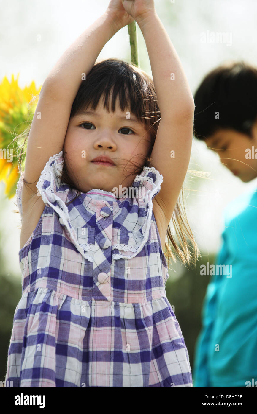 Oriental children playing outdoors Stock Photo - Alamy