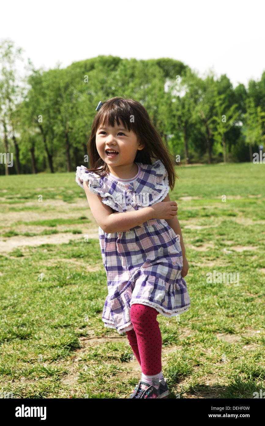A girl playing outside Stock Photo - Alamy