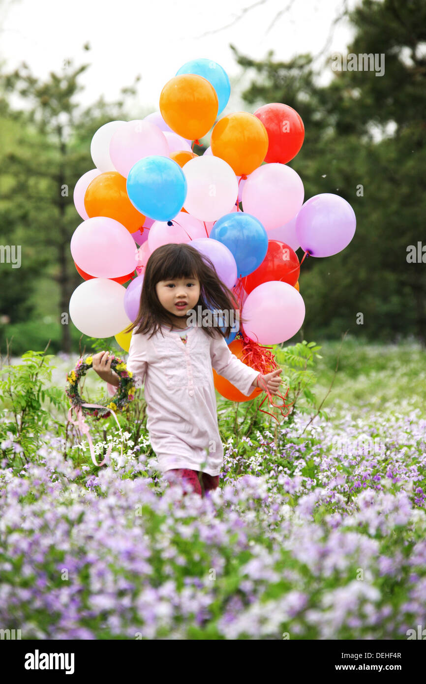 A girl playing outside Stock Photo - Alamy