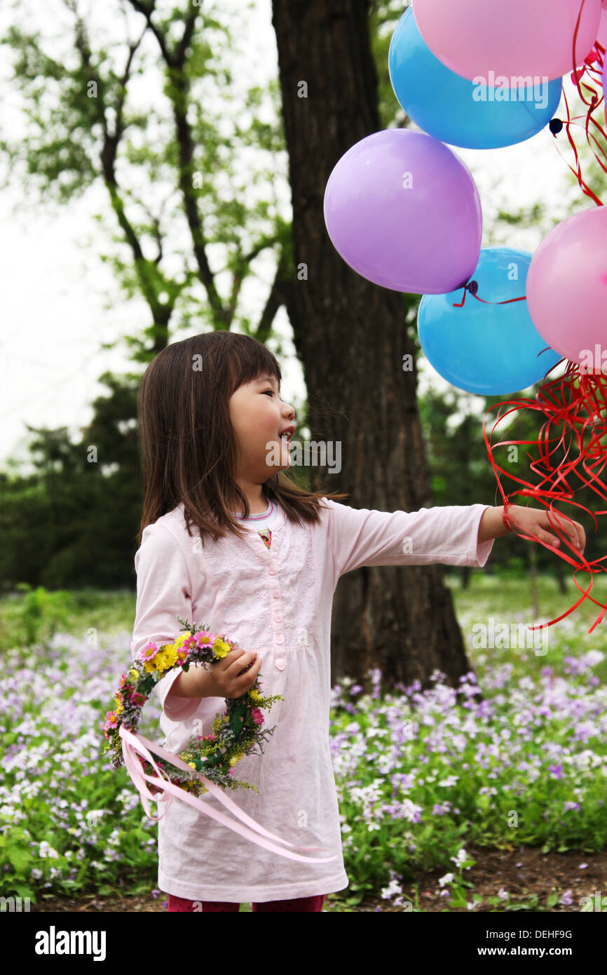 A girl playing outside Stock Photo - Alamy
