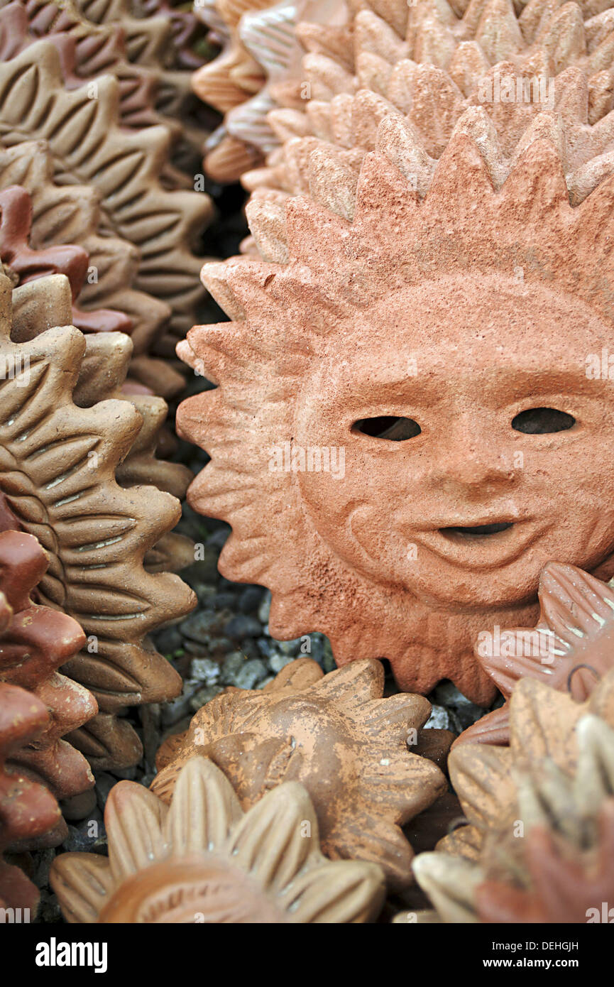 Terracotta sun faces hi-res stock photography and images - Alamy