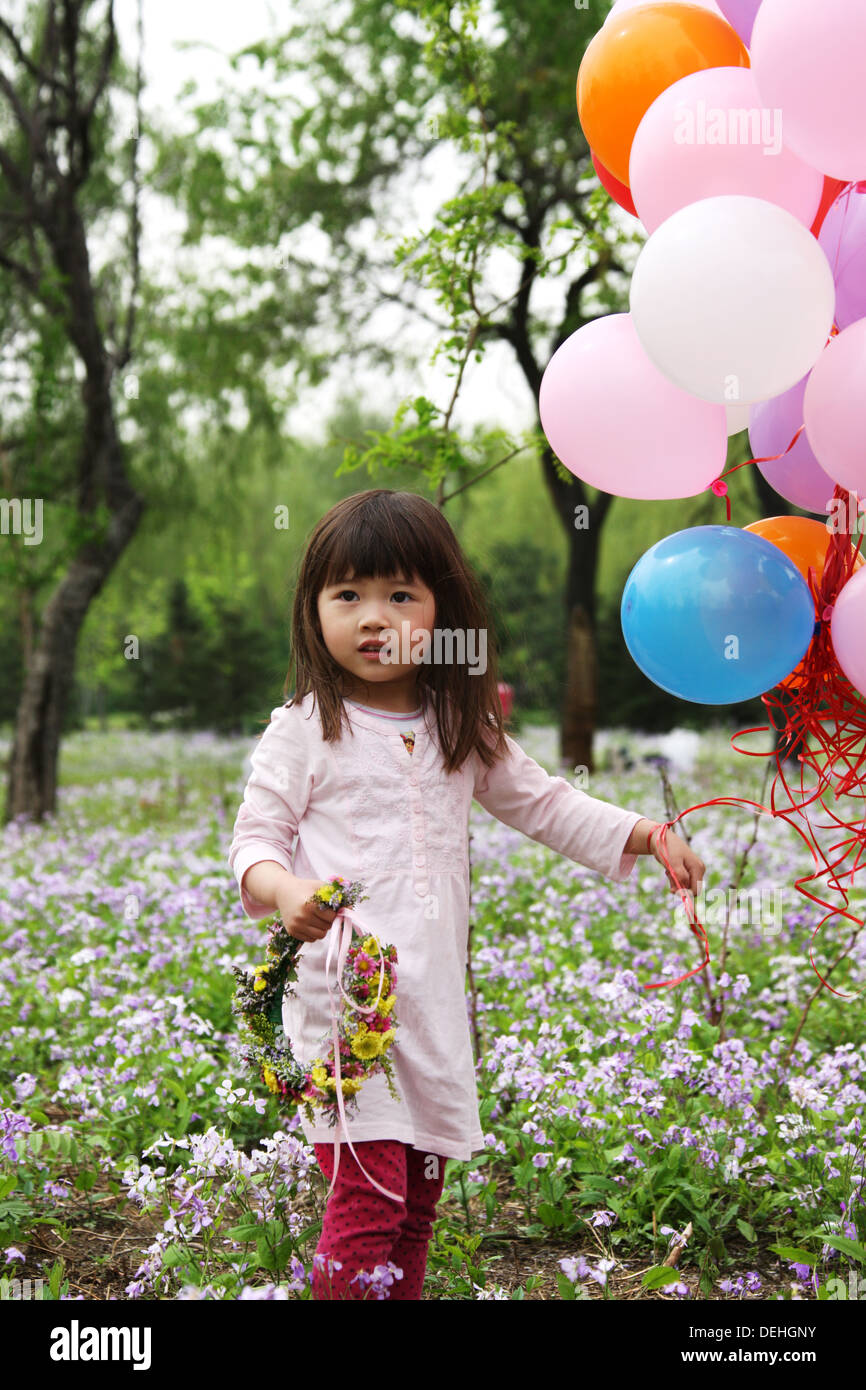 A girl playing outside Stock Photo - Alamy