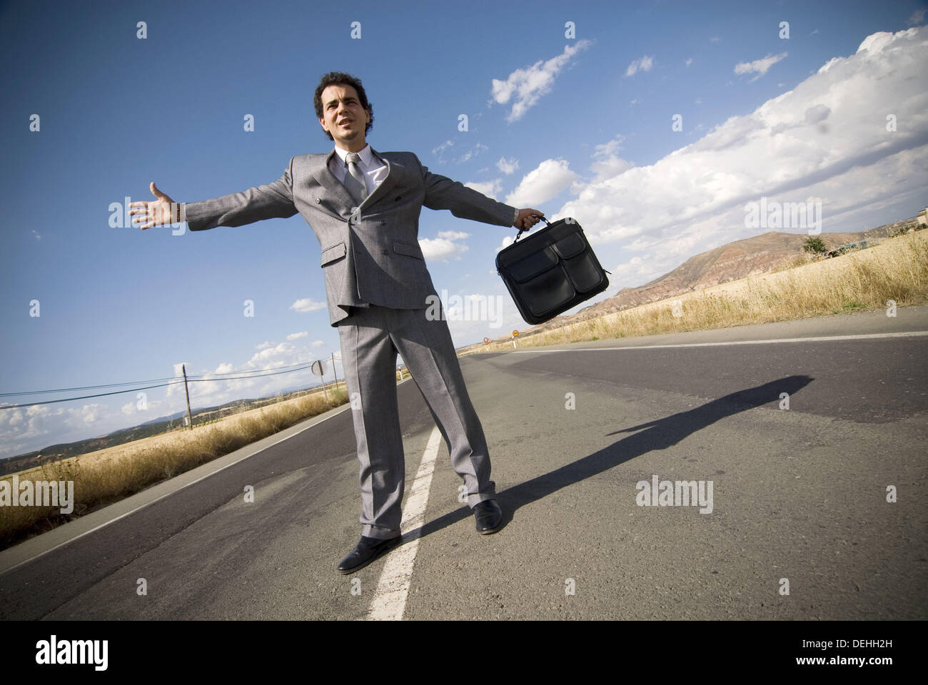 Man hitchhiking suit hi-res stock photography and images - Alamy