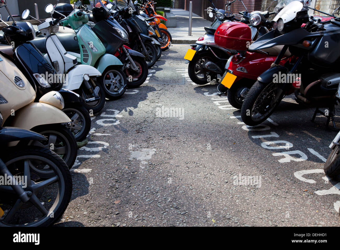 Motor bikes parked a row Stock Photo - Alamy