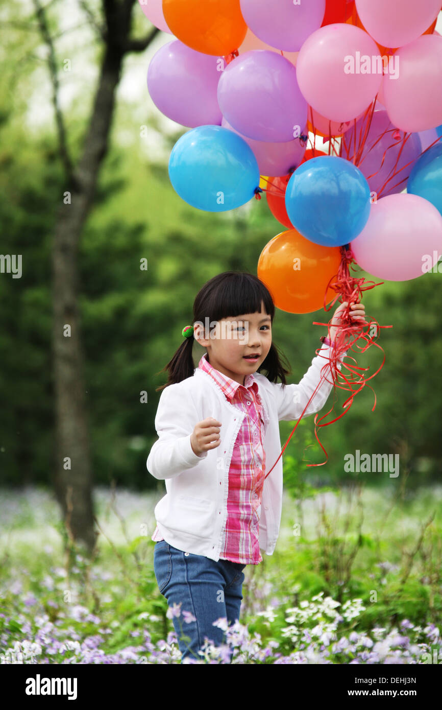 A girl playing outside Stock Photo - Alamy