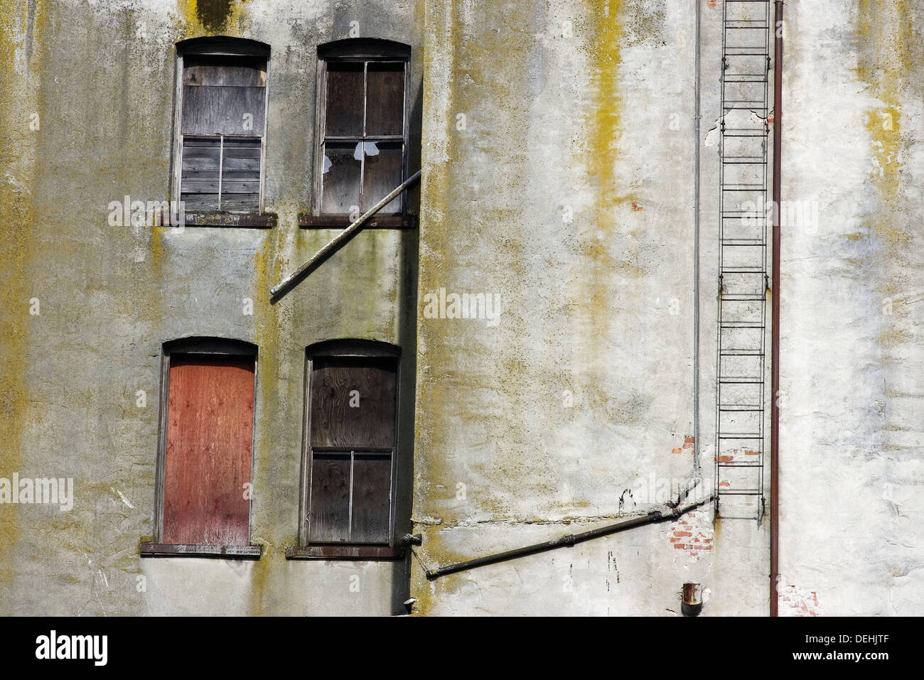 Windows and outer walls of a derelict building. Victoria, British ...