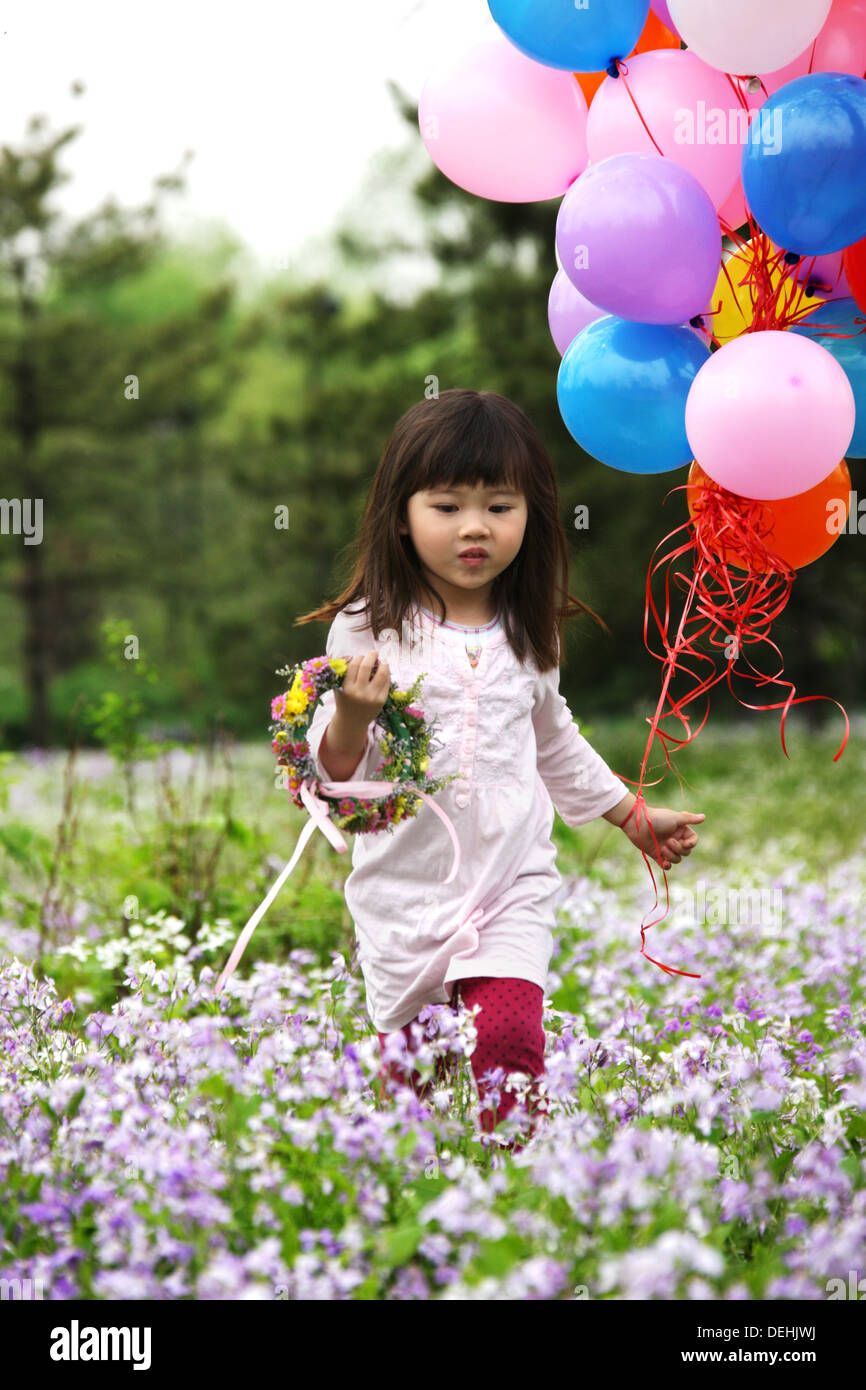 A girl playing outside Stock Photo - Alamy