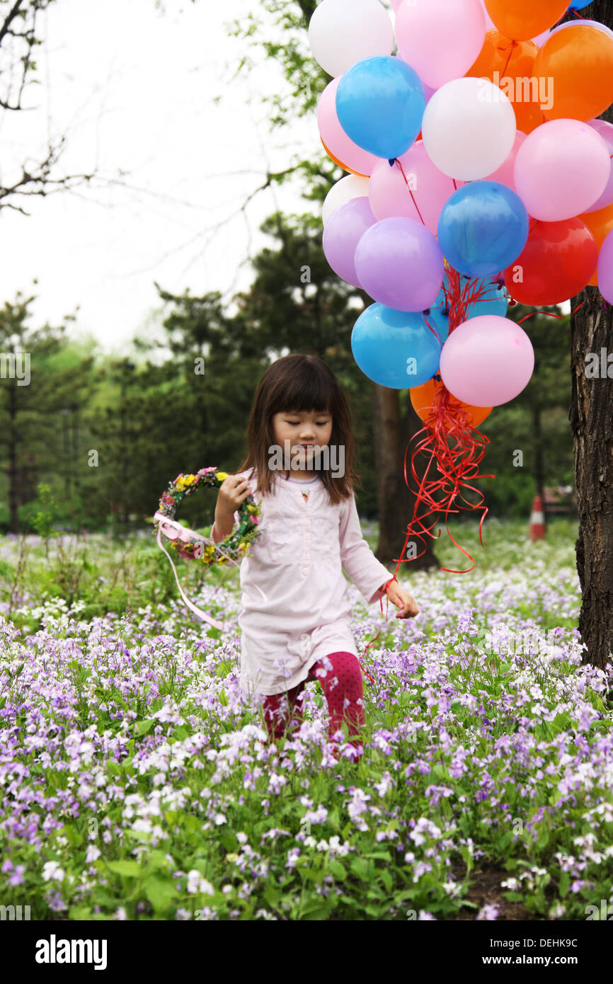 A girl playing outside Stock Photo - Alamy