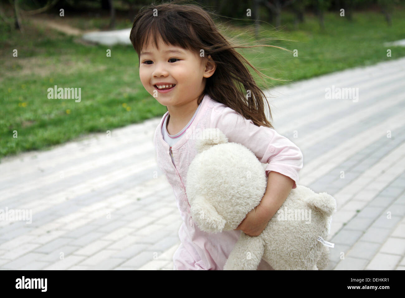 A girl playing outside Stock Photo - Alamy