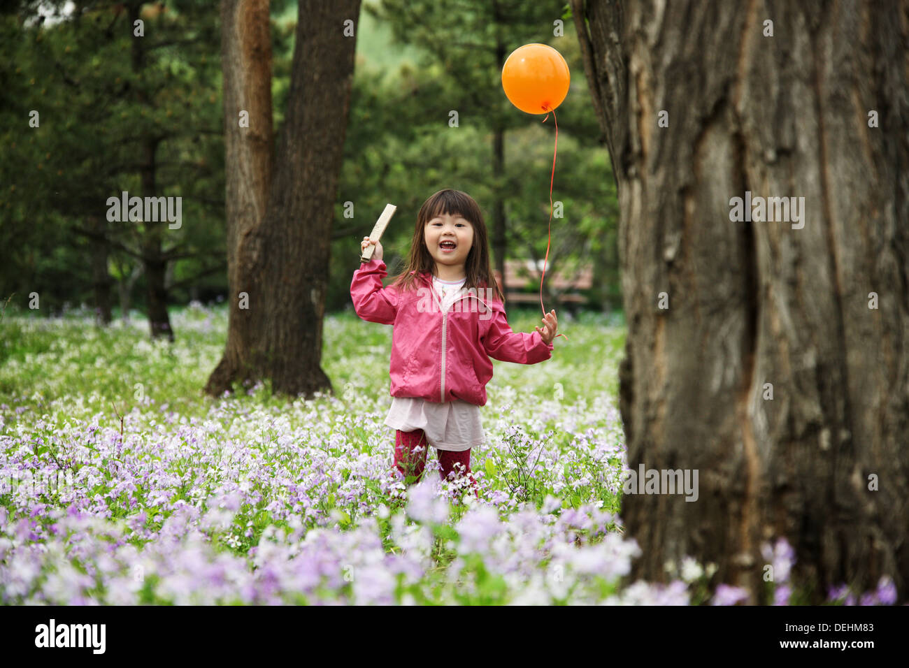 A girl playing outside Stock Photo - Alamy