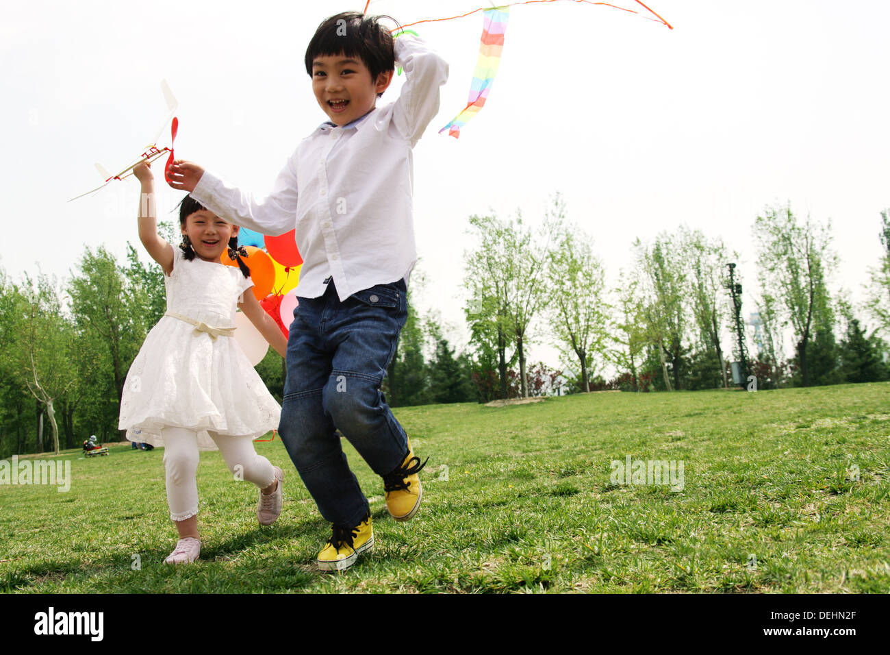 Oriental children playing outdoors Stock Photo - Alamy