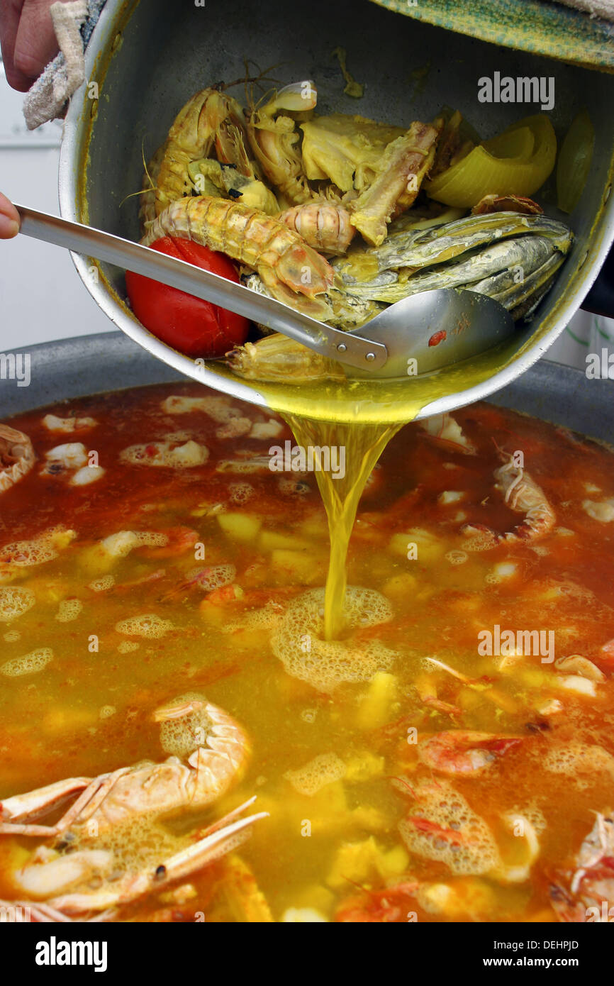 Pouring broth into pot hi-res stock photography and images - Alamy