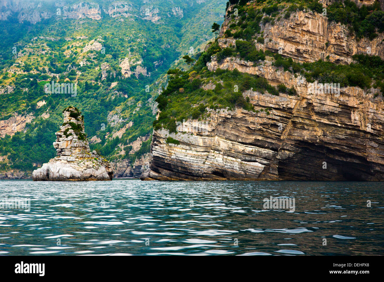 Limestone cliffs and cave in the sea, Capri, Campania, Italy Stock ...