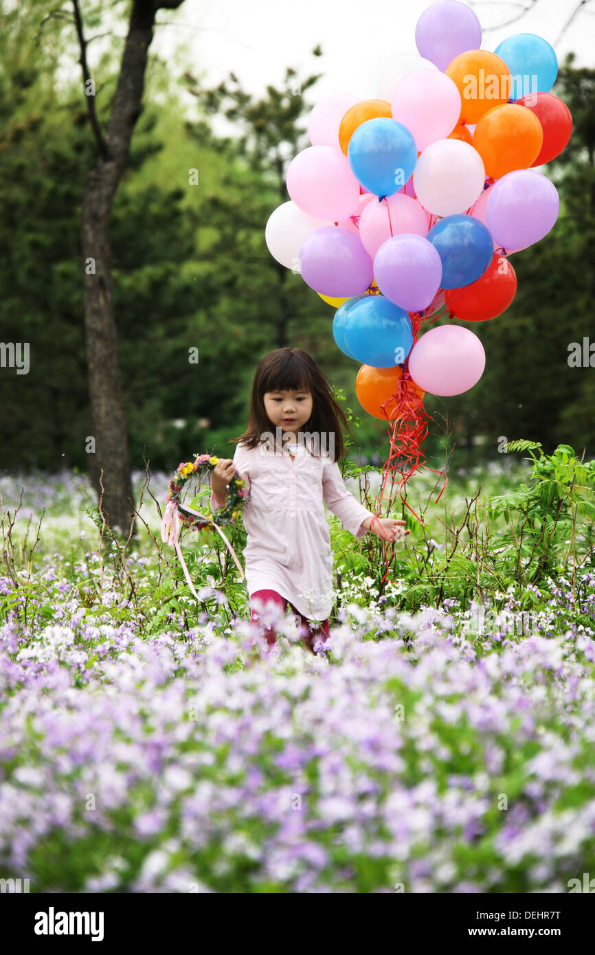 A girl playing outside Stock Photo - Alamy