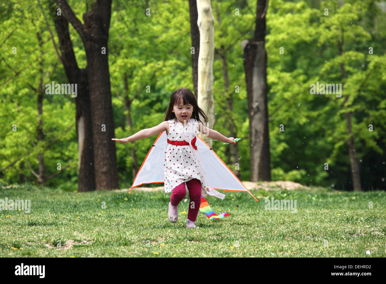 A girl playing outside Stock Photo - Alamy