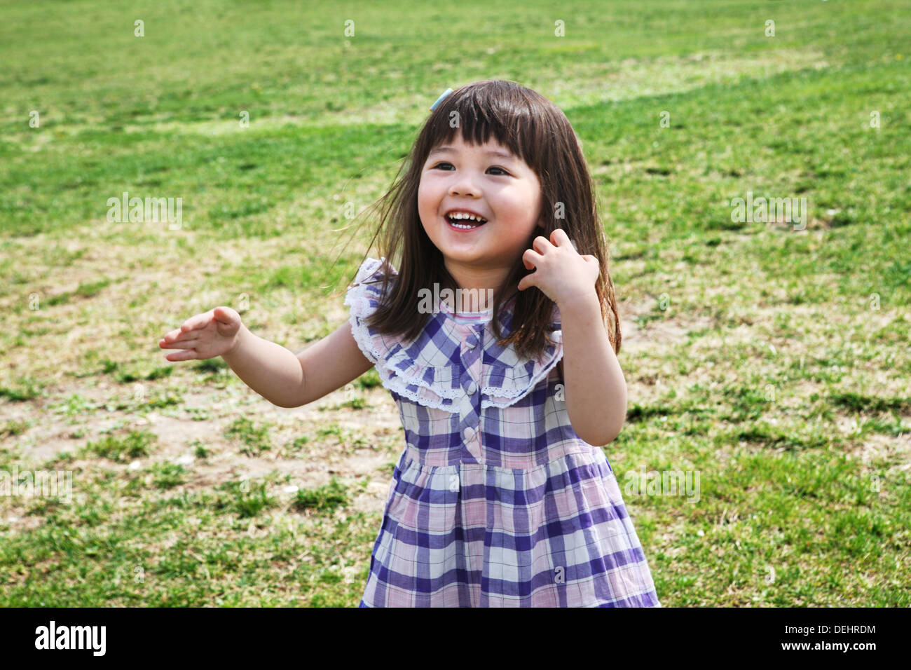 A girl playing outside Stock Photo - Alamy