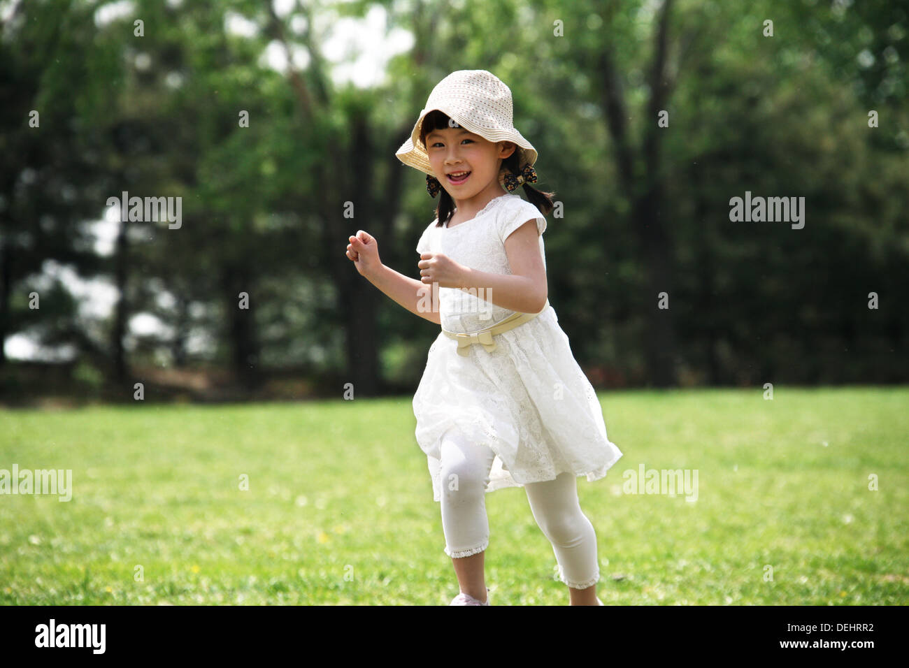 A girl playing outside Stock Photo - Alamy