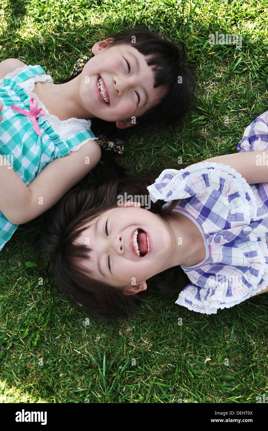 Oriental children playing outdoors Stock Photo - Alamy