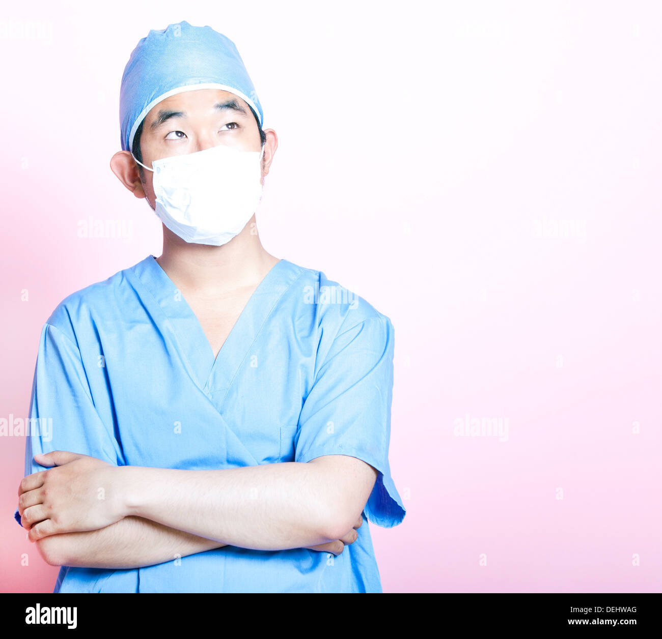 Young Asian surgeon with arms folded Stock Photo - Alamy