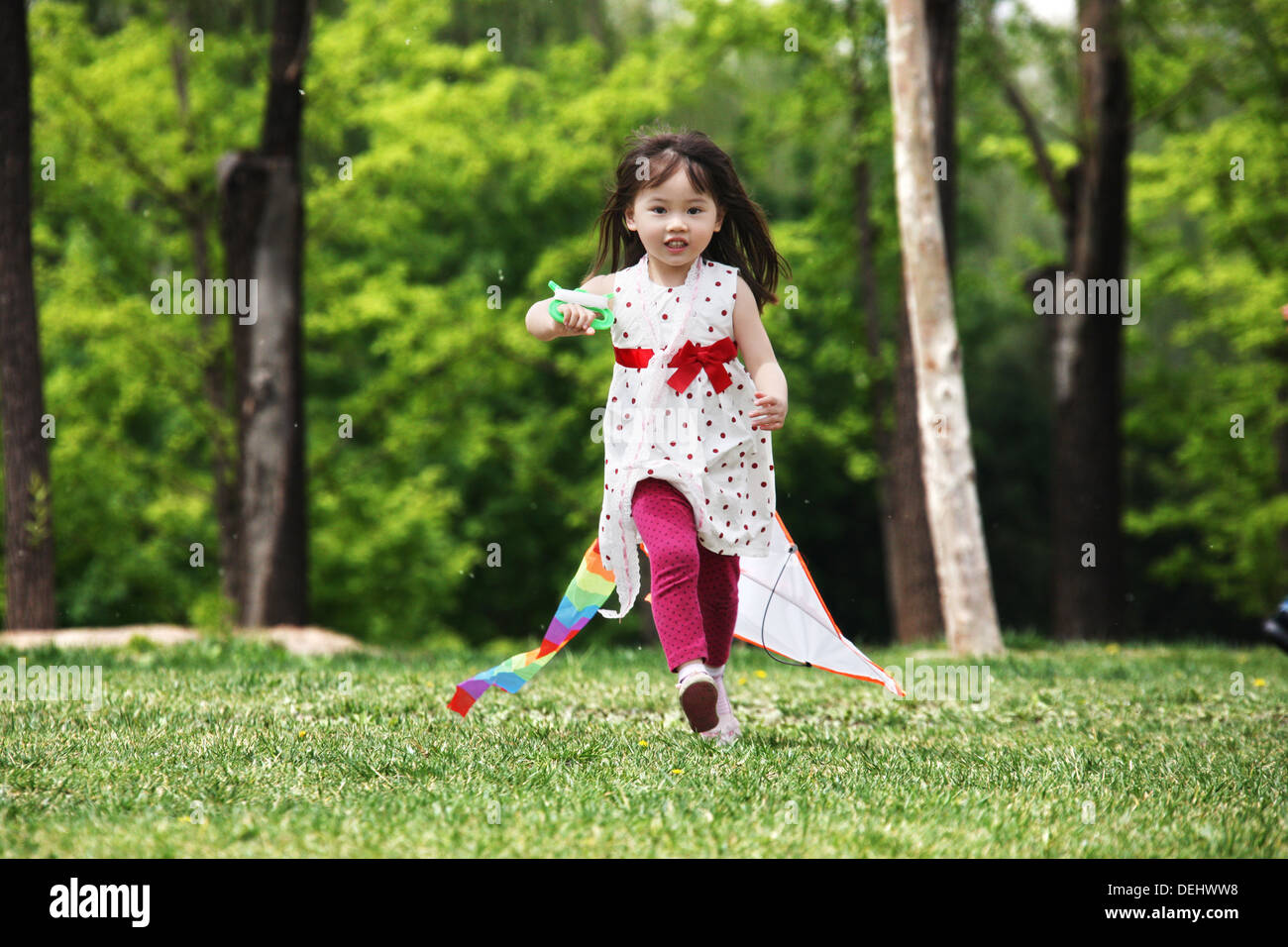 A girl playing outside Stock Photo - Alamy