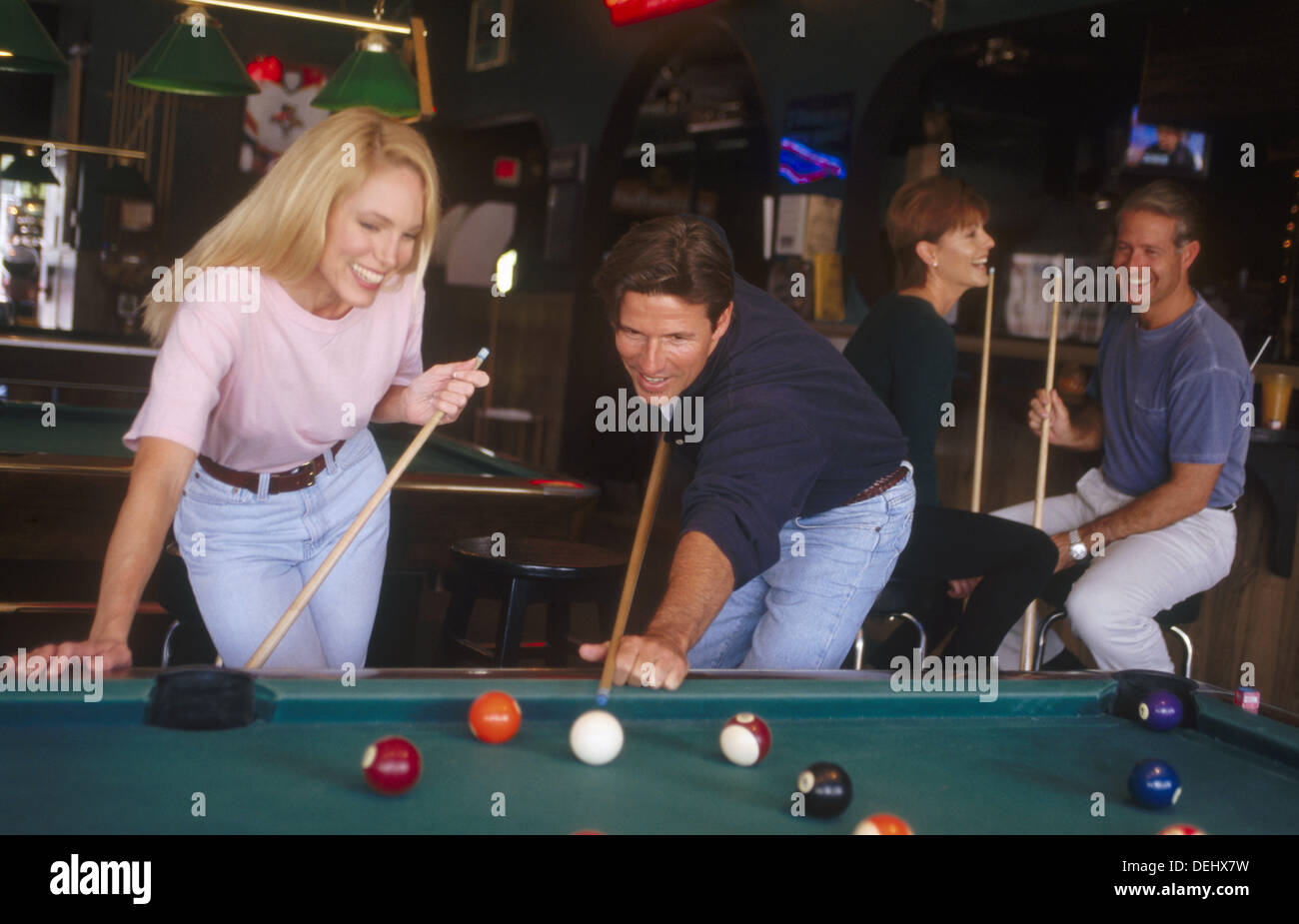 Young man shooting pool billiard hi-res stock photography and images ...