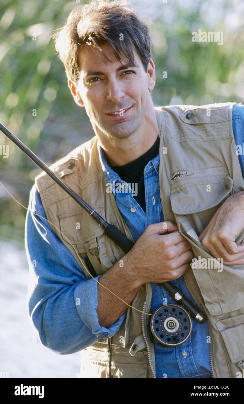 Handsome fly fisherman hi-res stock photography and images - Alamy