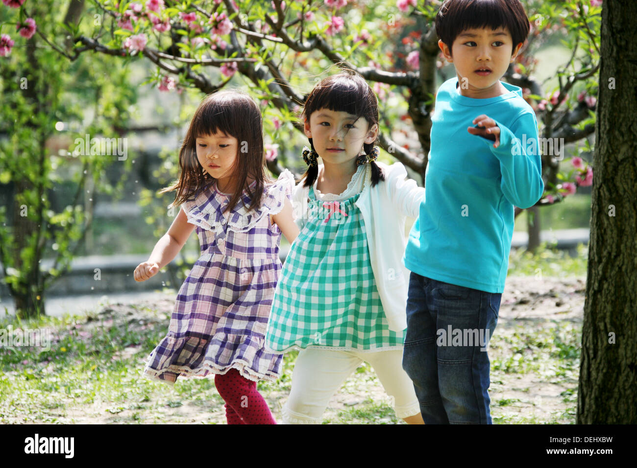 Oriental children playing outdoors Stock Photo - Alamy