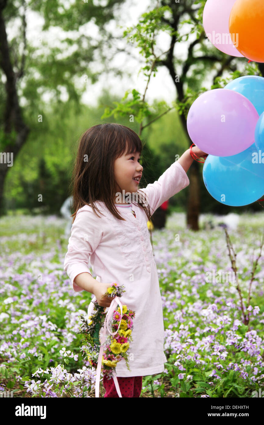 A girl playing outside Stock Photo - Alamy
