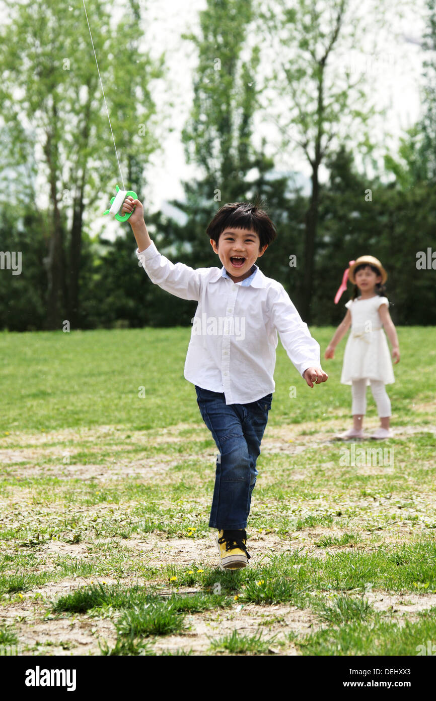 Oriental children playing outdoors Stock Photo - Alamy