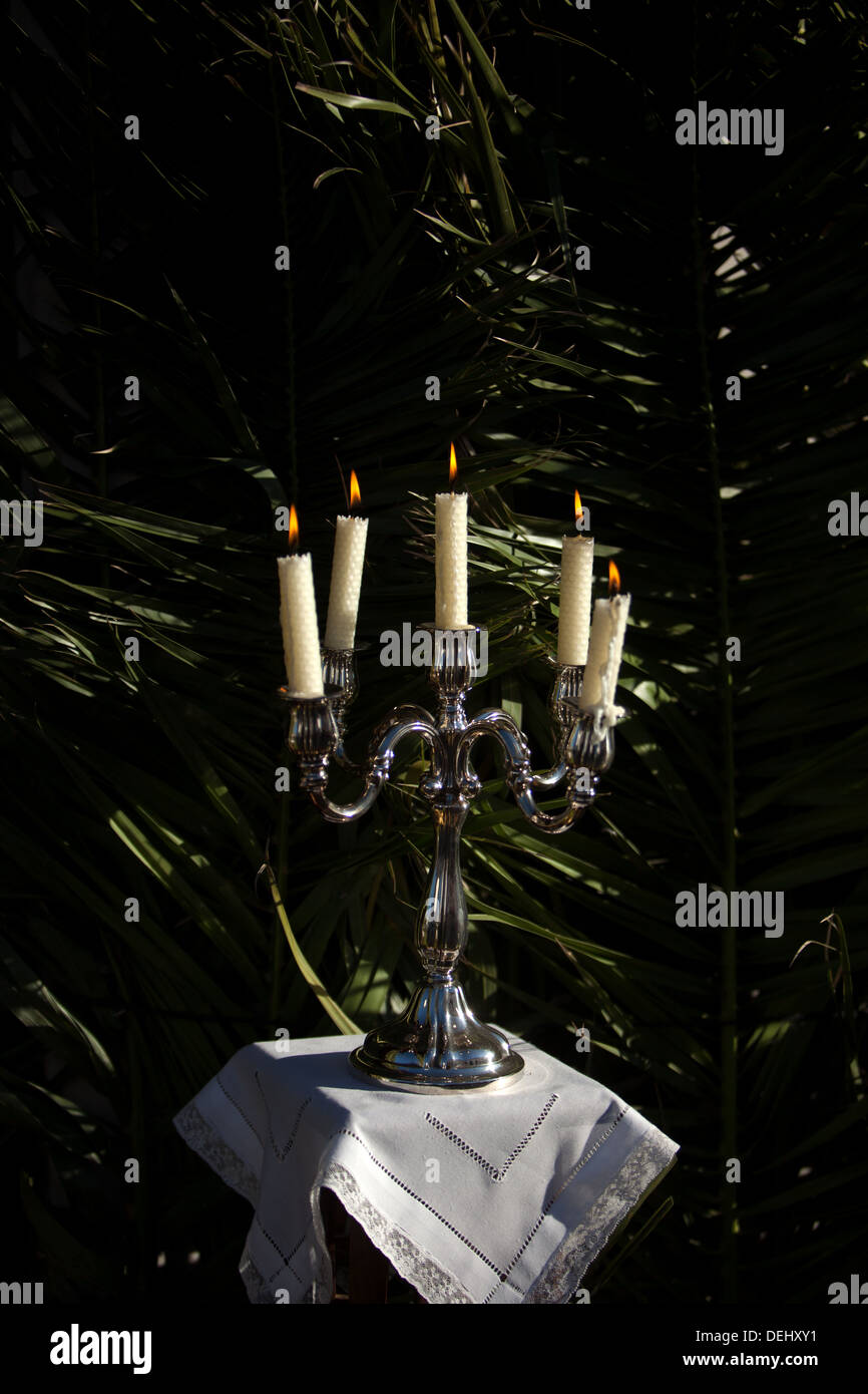 A candelabra decorates an altar during the Corpus Christi Catholic ...