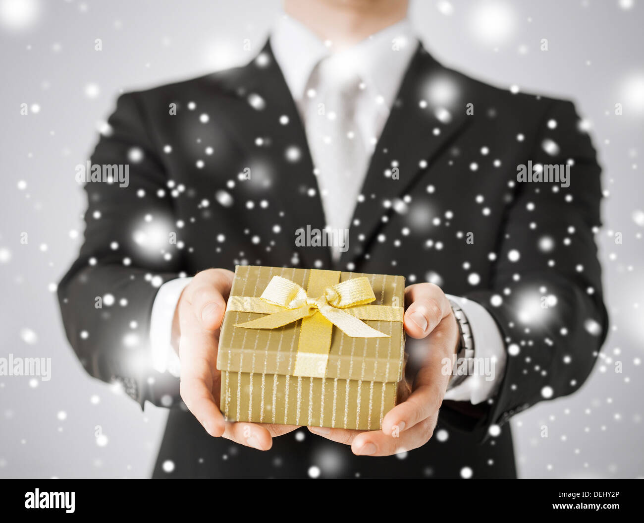 man giving gift box Stock Photo - Alamy